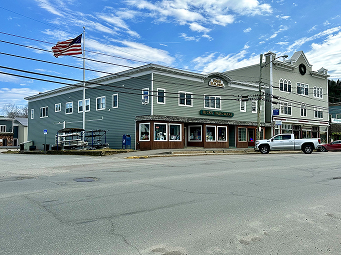 The American flag stands proud against Colebrook's skyline, where patriotism isn't a political statement but simply part of the town's DNA.