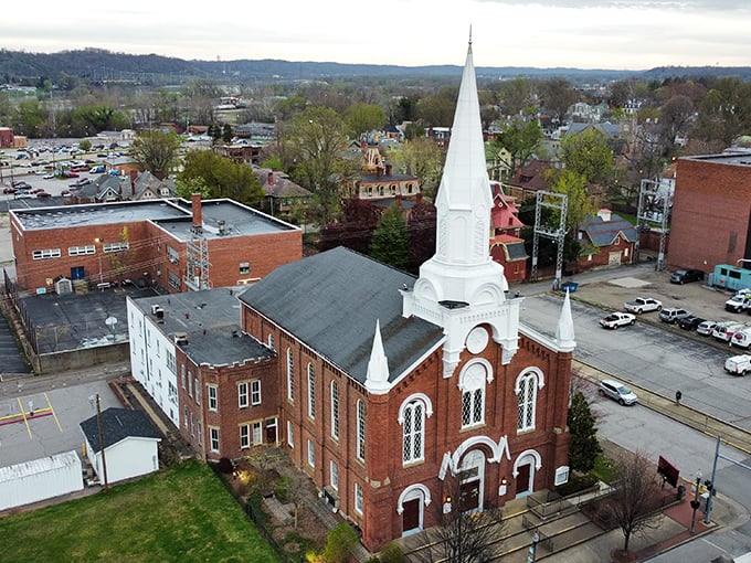 First Baptist Church's striking red brick and white spires create a postcard-worthy scene. Spiritual anchors like this form the backbone of community life.
