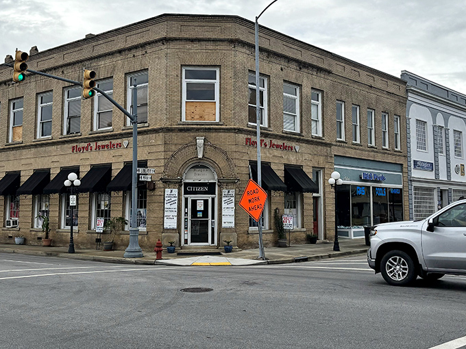 Floyd's Jewelers anchors this corner like it's 1955, when downtown businesses were the heartbeat of American communities.