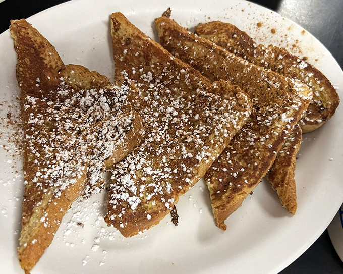 French toast dusted with powdered sugar and cinnamon&mdash;breakfast that doubles as dessert without a hint of guilt. Morning magic on a plate.
