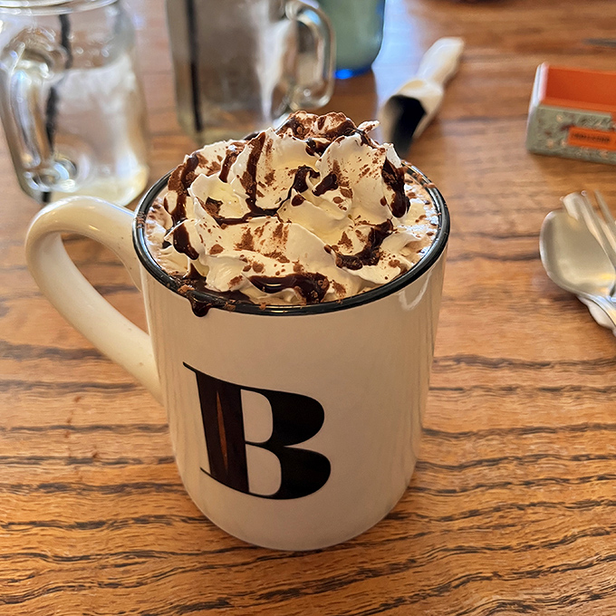 Hot chocolate that's wearing formal attire. The whipped cream hat and chocolate drizzle tie make this mug ready for the beverage red carpet.