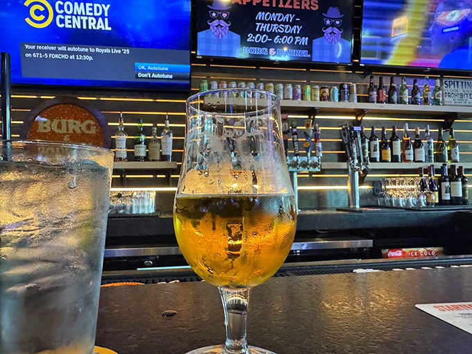 A perfectly poured craft beer catching the light just right&mdash;liquid amber waiting to complement whatever burger masterpiece you've chosen.