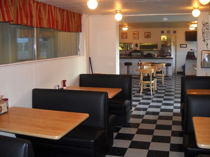 The checkered floor and cozy booths create that perfect diner atmosphere where calories don't count and coffee refills are practically mandatory.