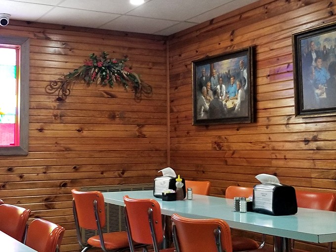 Warm wood paneling and simple decor create the backdrop for countless family gatherings and morning coffee rituals.