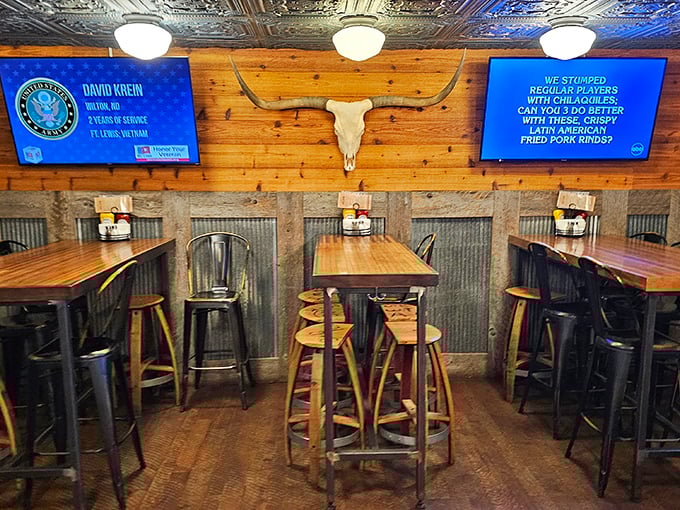 High-top tables and mounted trophies create that perfect "fancy but not fussy" vibe where both cowboys and accountants feel equally at home.