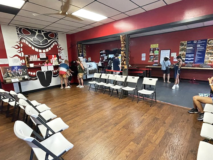 Red walls, wooden chairs, and ceiling fans create the perfect no-frills backdrop for food that needs no fancy setting to shine.