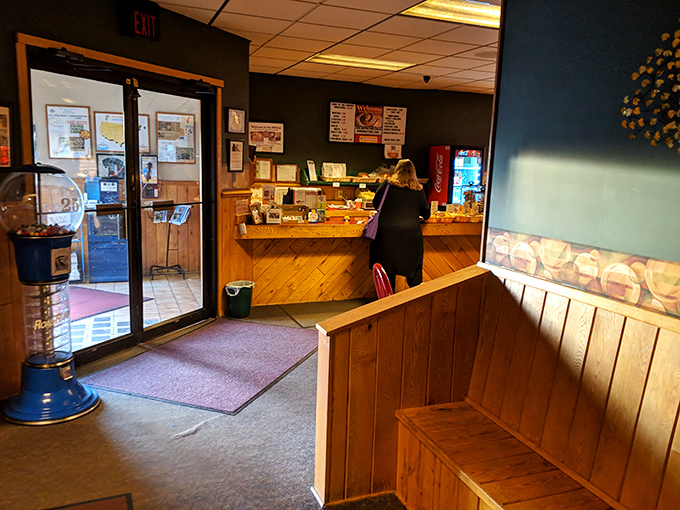 The entrance area welcomes you like an old friend, with wooden accents and the promise of baked goods just steps away.