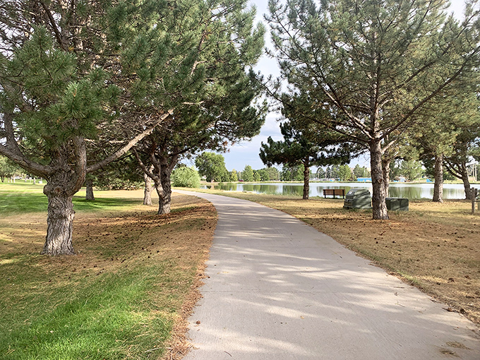 Laing Park's tree-lined paths invite contemplative strolls. The water reflecting those big Nebraska skies is nature's perfect screensaver.