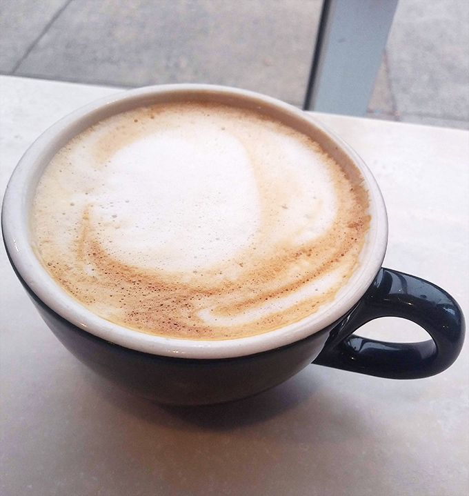 A perfectly crafted latte with silky foam art&mdash;the ideal companion for your donut expedition. Coffee and donuts: civilization's greatest pairing.