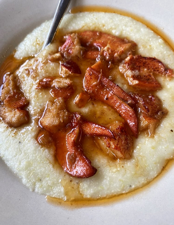 Grits elevated to art form: creamy cornmeal cradling caramelized apples and a drizzle of syrup that makes you question everything you thought you knew about breakfast.