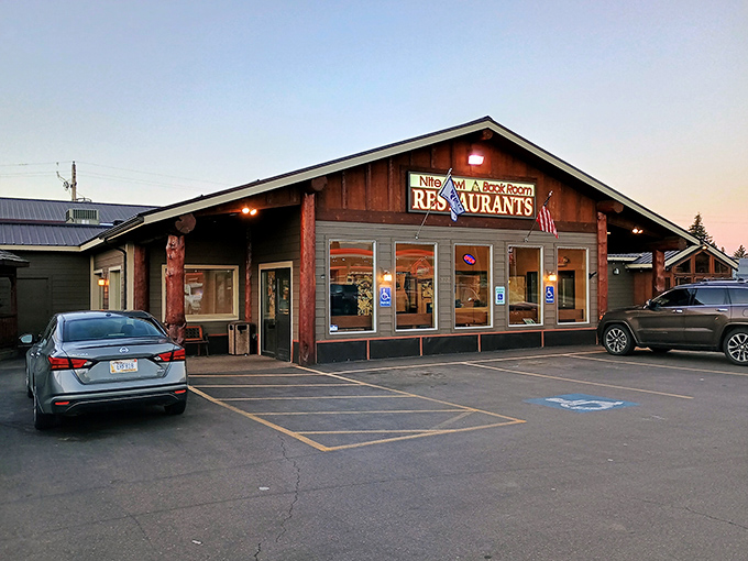 The Nite Owl's warm glow beckons hungry travelers with promises of hearty Montana fare after adventure-filled days.