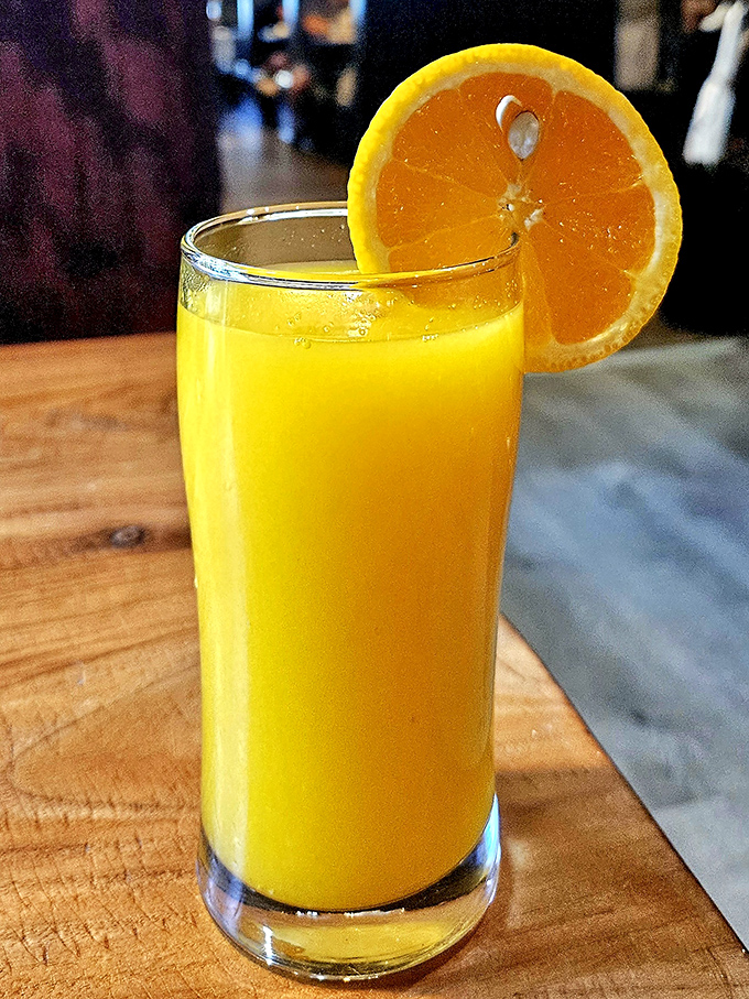 Fresh-squeezed orange juice that glows like liquid sunshine &ndash; the kind that makes you wonder why you ever settled for the bottled stuff.