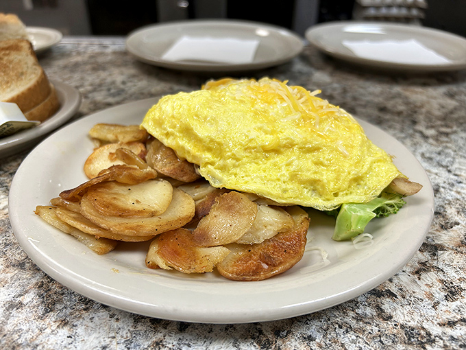 An omelet that knows its purpose in life is to be delicious. Perfectly folded around golden potatoes, it's breakfast architecture at its finest.