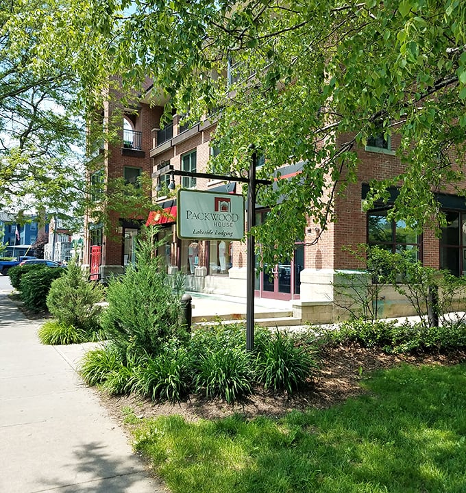 Packwood House's elegant brick facade and tasteful landscaping set the tone for upscale lakeside lodging with a dash of sophistication.