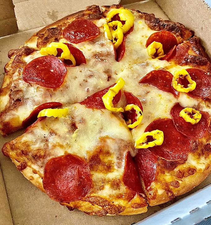 A personal pizza that proves size isn't everything – especially when topped with pepperoni and banana peppers that mean serious business.