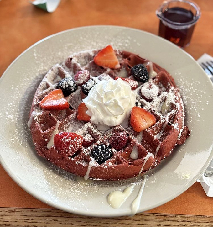 This red velvet waffle topped with fresh berries and whipped cream isn't just breakfast&mdash;it's what birthday cake wishes it could be.