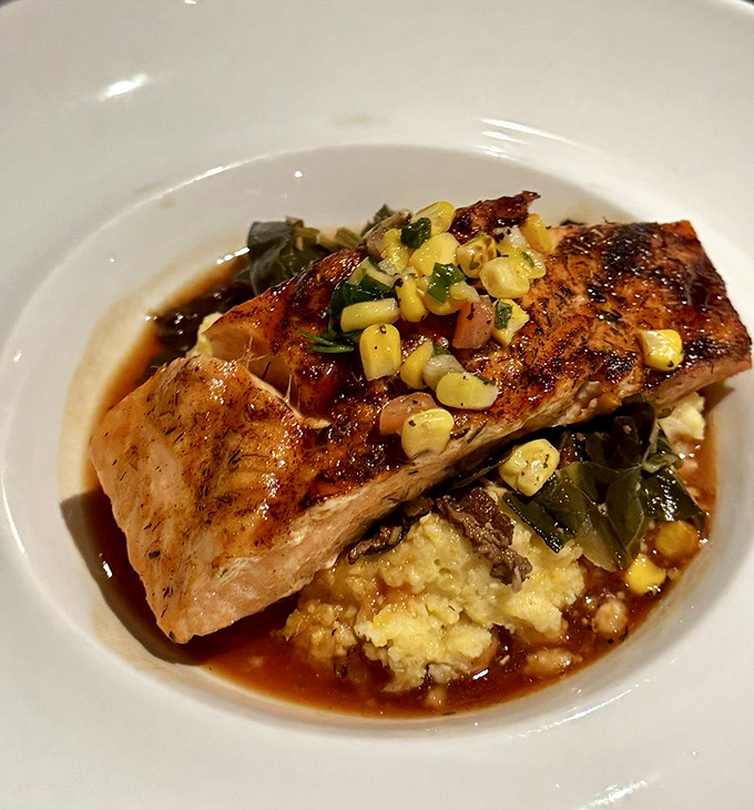 Salmon that doesn't just sit on the plate&mdash;it lounges luxuriously atop creamy grits like it owns the place.