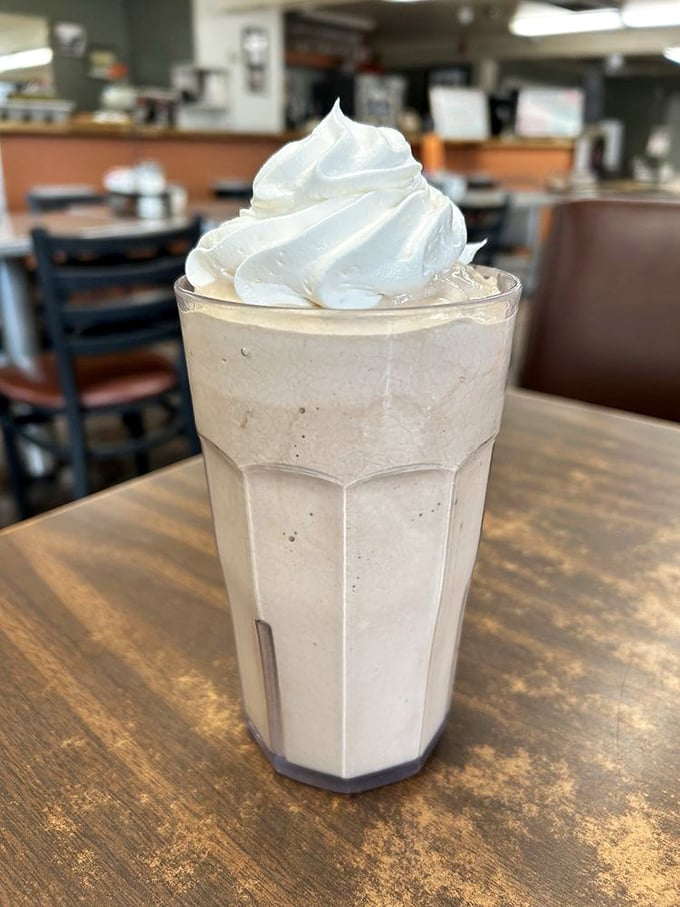 The milkshake so thick it defies gravity, topped with a cloud of whipped cream that makes you feel like a kid again.