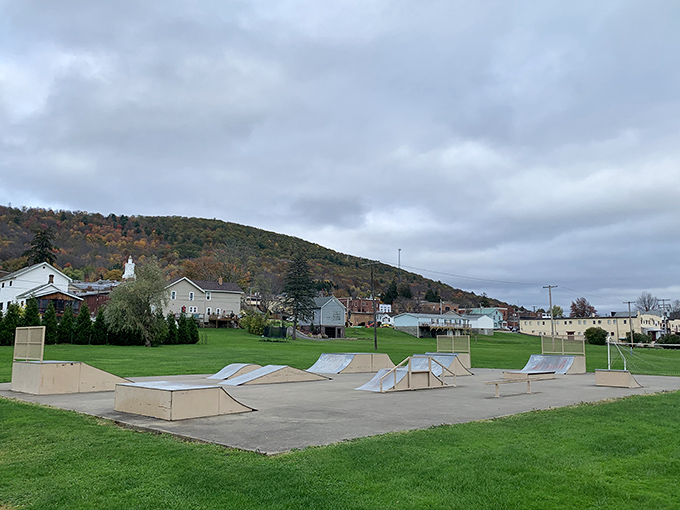 The skatepark sits ready for action against a backdrop of rolling Pennsylvania hills, proving small towns understand that kids need places to ollie and grind just as much as city kids.
