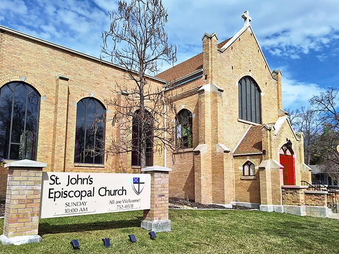 St. John's Episcopal Church welcomes all with its warm brick exterior and stunning windows, offering spiritual refuge regardless of your theological leanings.