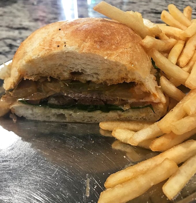 Half-eaten sandwich tells the tale&mdash;too delicious to wait for a photo. Crusty bread meets tender meat in a handheld masterpiece.