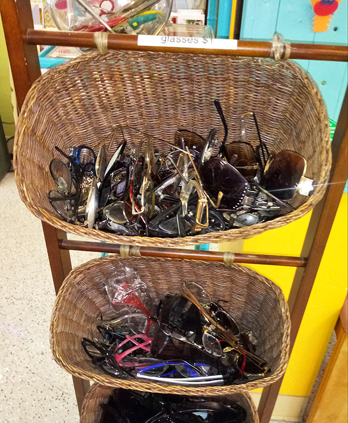 The ultimate sunglasses graveyard—or paradise, depending on your perspective. Someone's forgotten frames are about to become your summer statement piece.