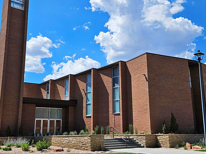 The Price Theatre's neon marquee glows like a beacon of nostalgia, promising movie magic in an era before streaming services conquered our couches.