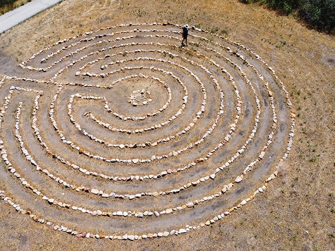 The Helper Labyrinth offers meditative moments in the desert. Who needs expensive yoga retreats when you've got stone circles and mountain views?