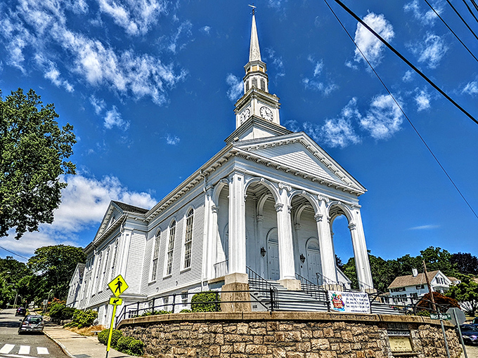 The Union Baptist Church reaches skyward with its gleaming white steeple, a spiritual lighthouse for the Mystic community.