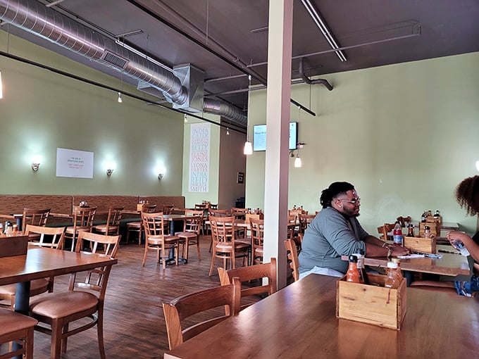 Industrial meets homey in this thoughtfully designed space. High ceilings and pendant lighting create an atmosphere where lingering over that last bite feels natural.