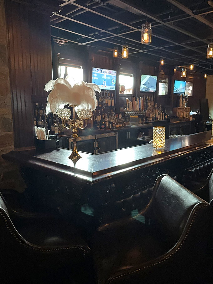 A bar that whispers "stay awhile" with elegant touches like feathered lamps that add just the right amount of dramatic flair.