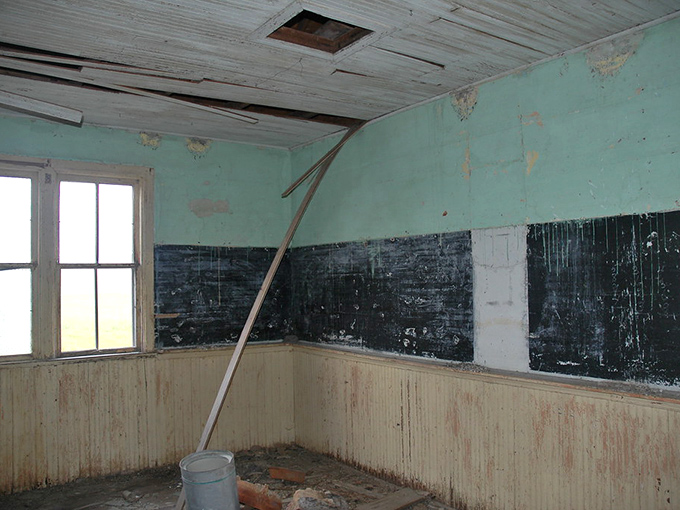 The classroom's blackboard&mdash;once filled with lessons&mdash;now teaches us about impermanence and the passage of time.