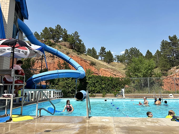 Nothing says "summer perfection" like a community pool with water slides. The laughter echoing off the hills is the soundtrack of childhood memories.