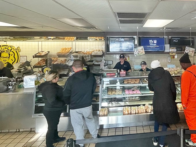 The universal language of donuts brings people together at Grebe's counter. Notice how nobody's checking their phones? That's donut power.