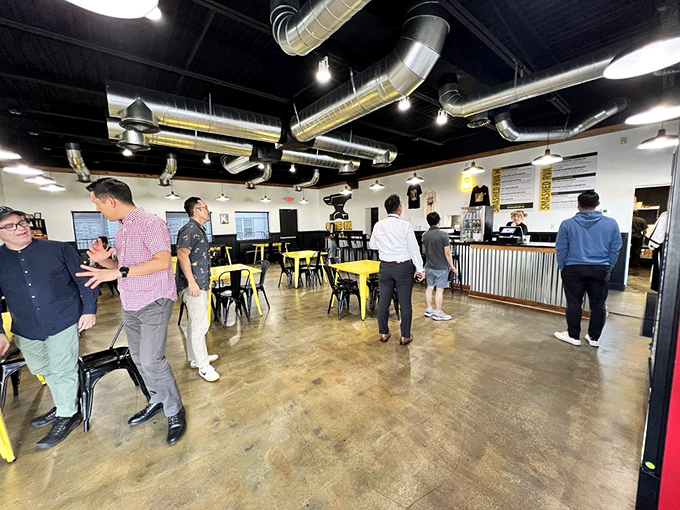 A bustling lunch crowd that knows the secret: sometimes the best business deals are sealed over smashed patties and good conversation.