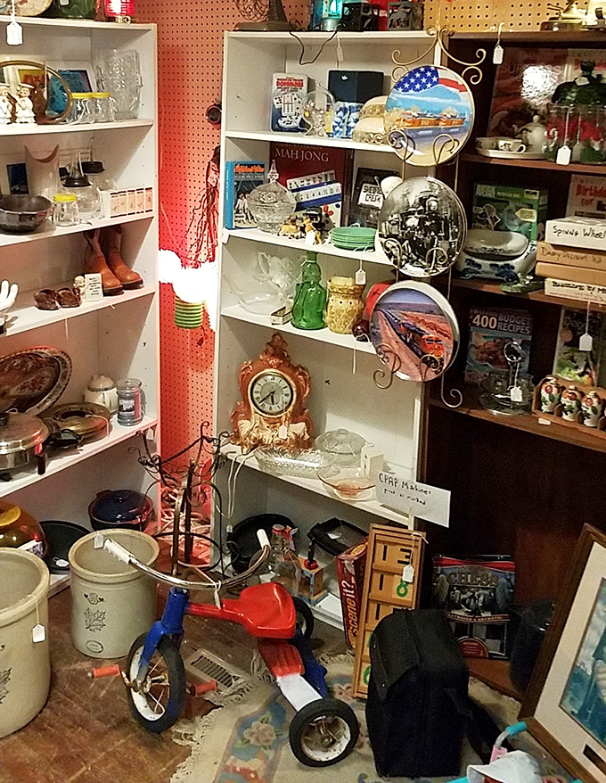 A childhood tricycle nestled among vintage kitchenware and board games—the ultimate "remember when" corner of nostalgia.