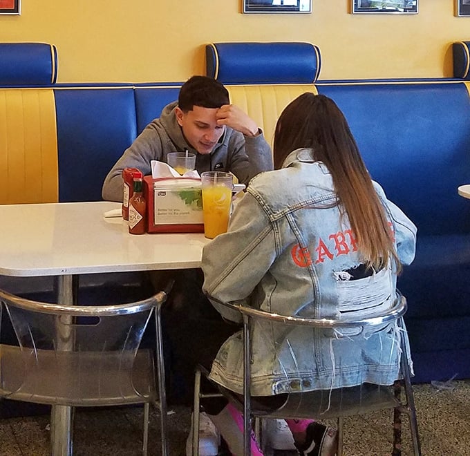 Every booth tells a story, but this one's writing a romance chapter with two people who've discovered the universal truth: good food makes good company better.