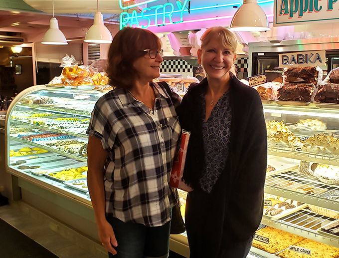 The bakery display showcases treats that make dieting seem like a concept invented by people who hate joy.