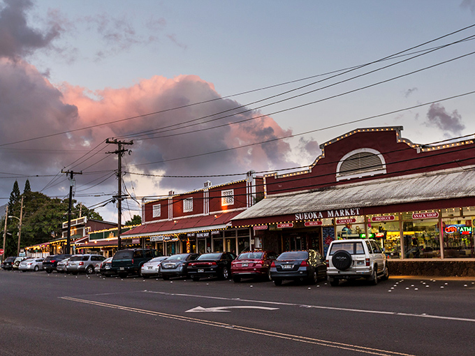 As dusk settles over Koloa's main street, the historic buildings glow with warmth against cotton candy clouds&mdash;no filter required.