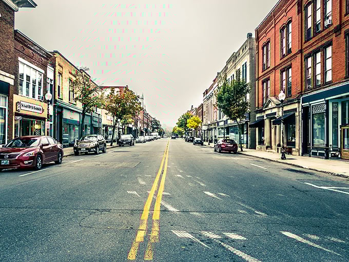Claremont's main street stretches invitingly between historic buildings, a perfect small-town tableau where every storefront holds potential for discovery.