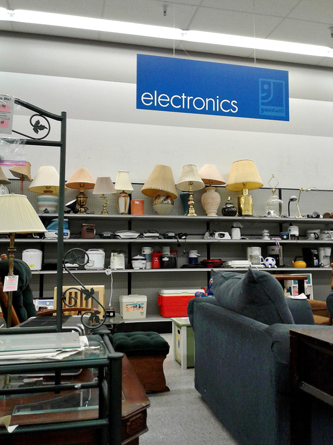 Lamp heaven under the "electronics" sign. One shopper's castoff becomes another's reading nook illumination.