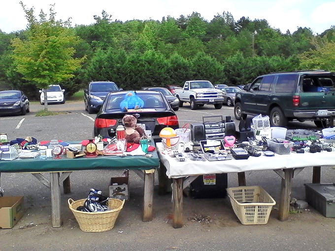 Everyday treasures spread across makeshift tables &ndash; where someone's spring cleaning becomes your kitchen's new conversation piece.