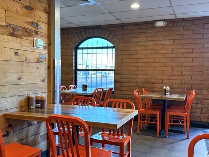The dining area&mdash;where strangers become friends united by the brotherhood of exceptional barbecue and bright orange chairs.