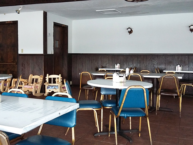 Another dining area showcases the restaurant's no-nonsense approach &ndash; blue chairs, clean tables, and an atmosphere that says "focus on the food."