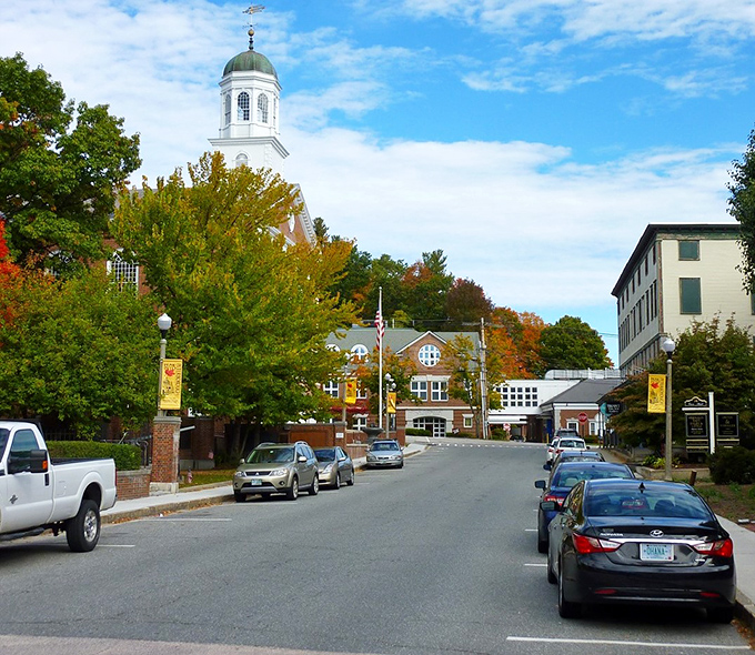 Fall foliage frames Peterborough's main drag with nature's confetti. The church steeple stands sentinel over a perfect autumn day.