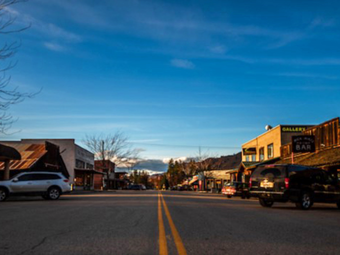 Dusk settles on Twisp's main drag like a gentle blanket, transforming ordinary storefronts into a scene worthy of a Norman Rockwell painting.