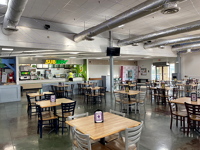 The food court's Subway offers a refueling station for weary shoppers, where sandwich artistry meets shopping stamina.