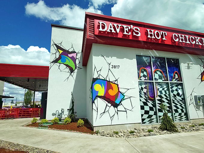 Dave's Hot Chicken brings street art energy to Salem. Those colorful "cracks" in the wall hint at the flavor explosion waiting inside.