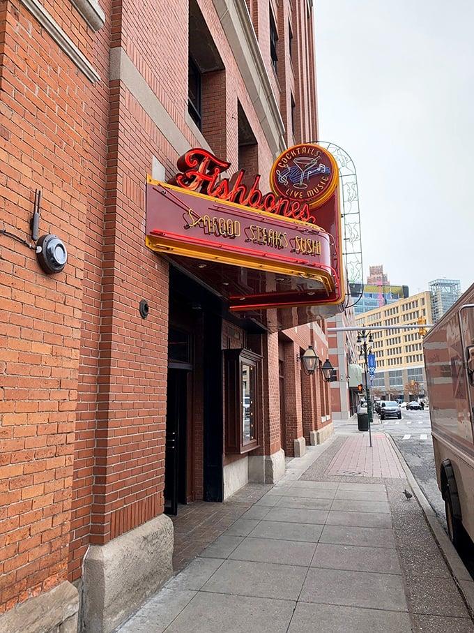 Fishbones' brick exterior keeps it real in Greektown. That vintage-style sign promises seafood with Detroit attitude!