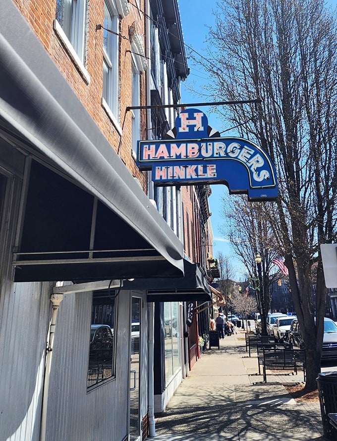 Hinkle's vintage blue sign hanging proudly above the sidewalk &ndash; a beacon of sandwich hope for downtown Madison.